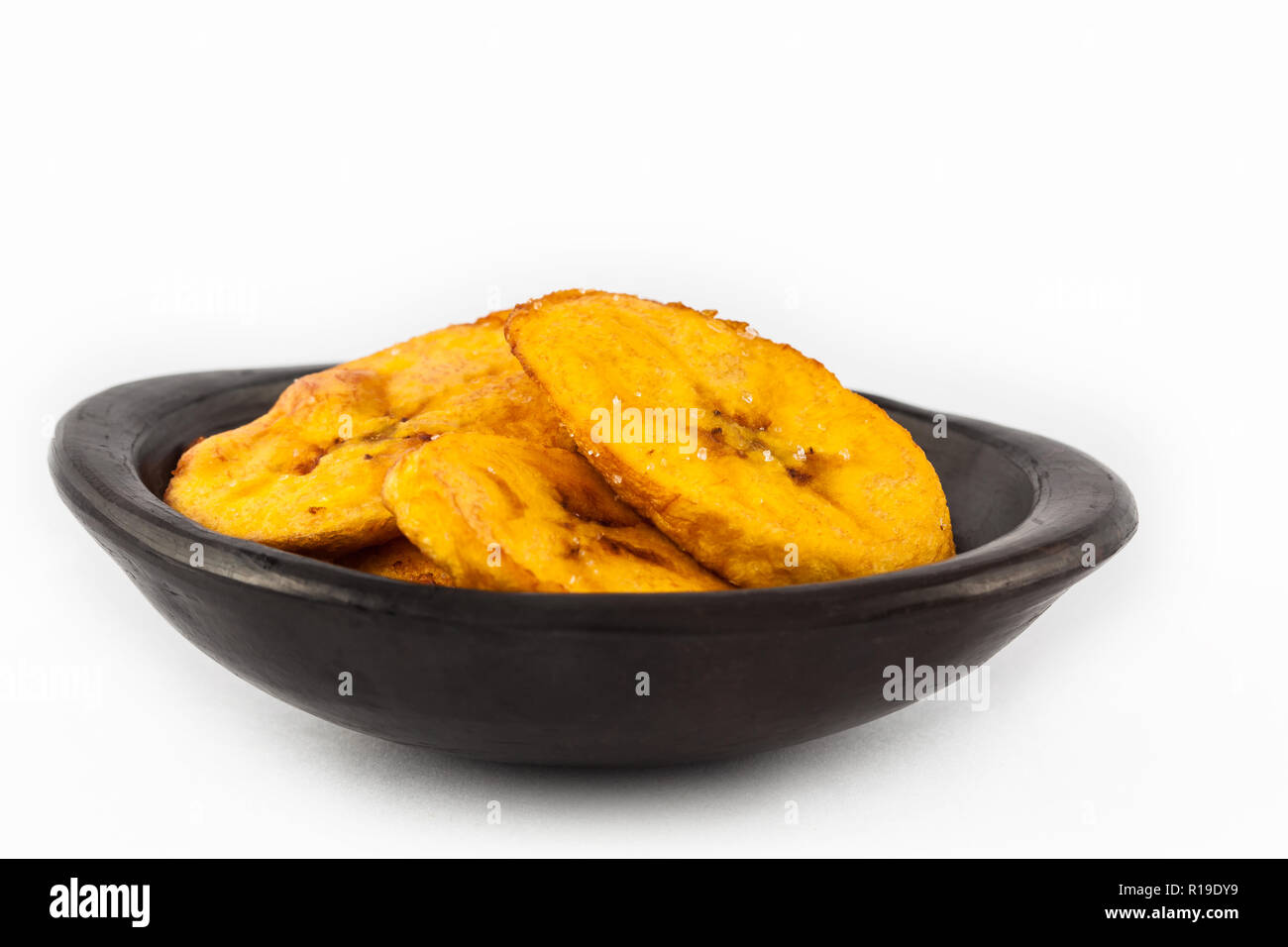 Fried half ripe plantain slices isolated on white background Stock ...