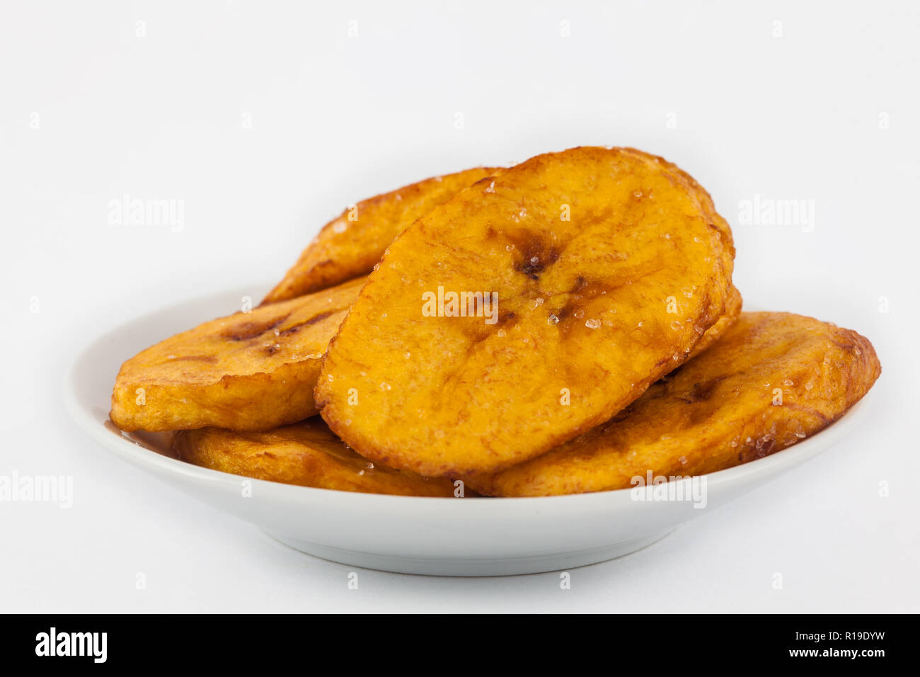 Fried half ripe plantain slices isolated on white background Stock ...
