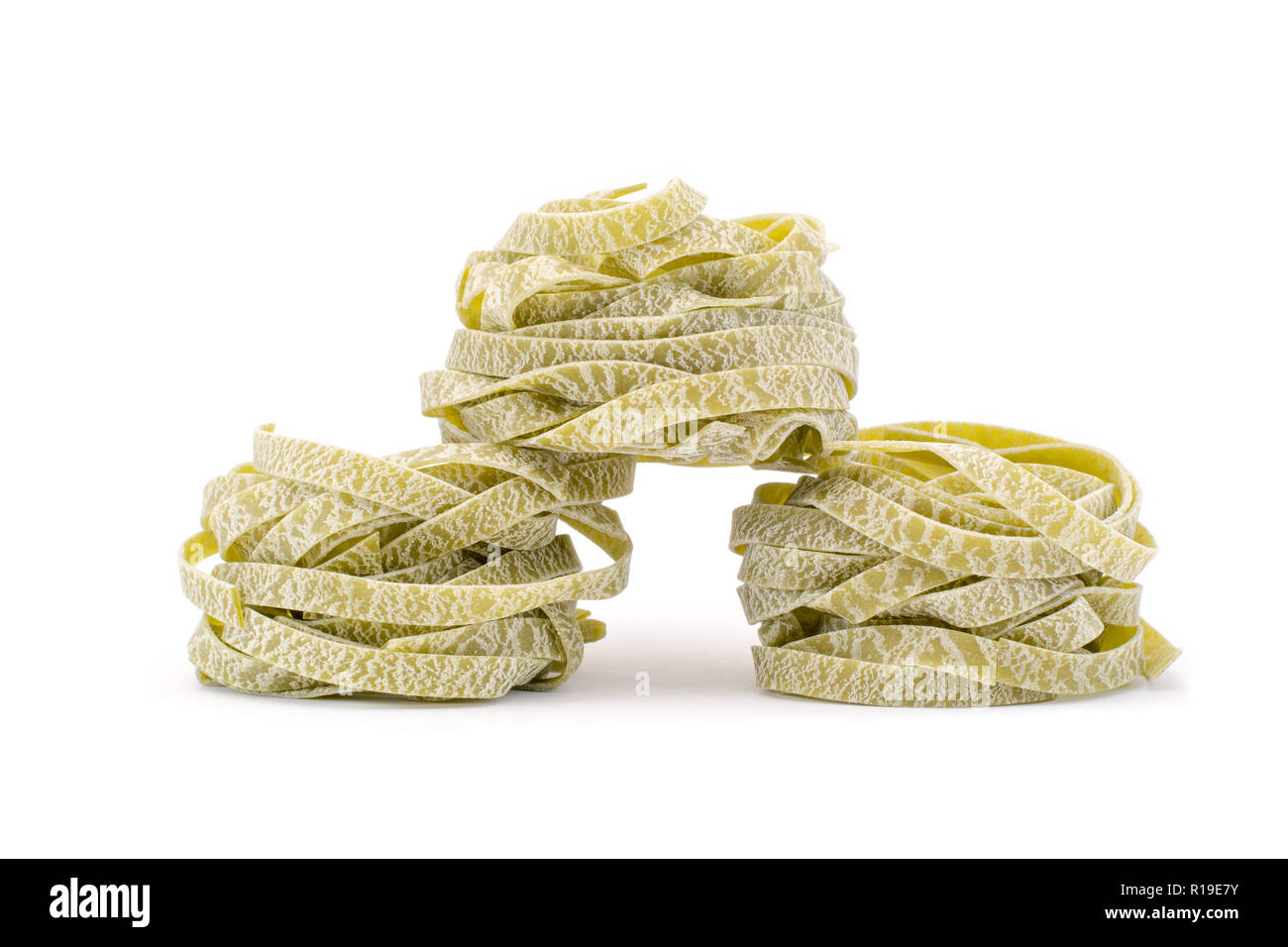 three roll pasta on a white background Stock Photo - Alamy