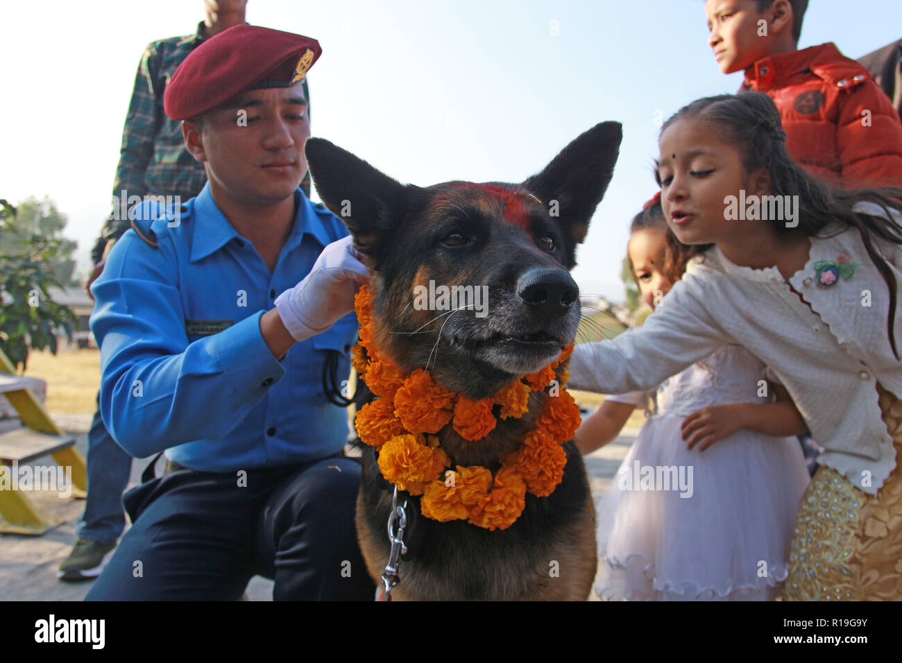 A policeman celebrate the festival part of ritual on Kukur Tihar, the ...