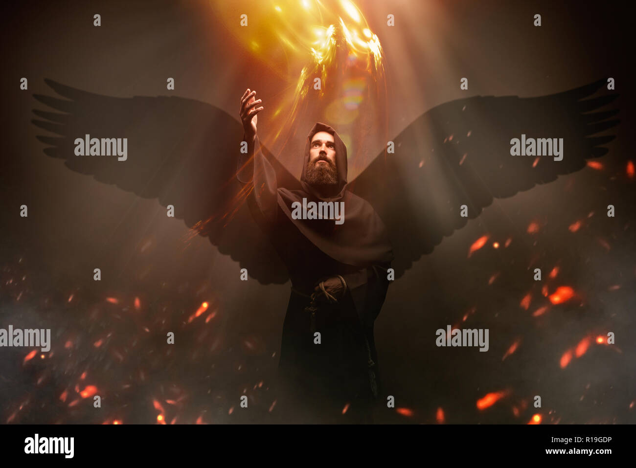 Medieval monk with wings, religion. Mysterious friar flying in dark ...