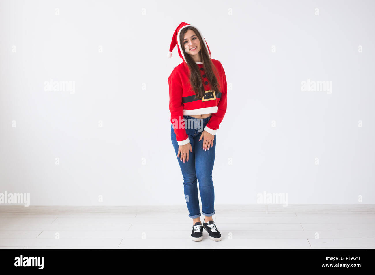 Holidays and people concept - Portrait of funny laughing woman in Santa ...