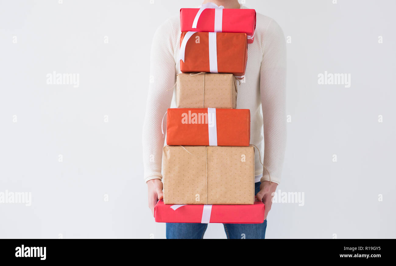 Christmas, holidays and presents concept - Close up of man holding a ...