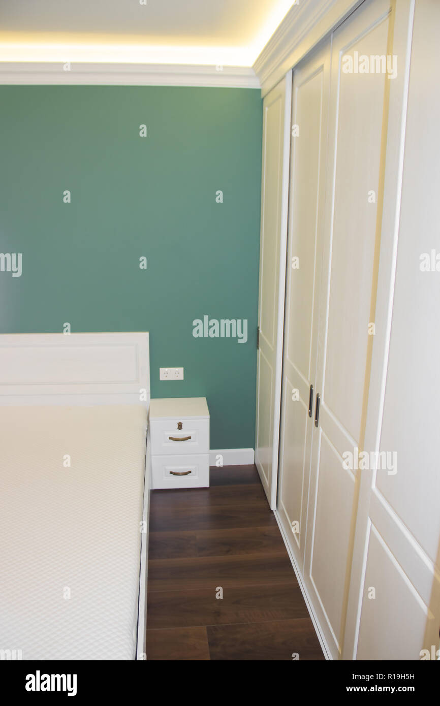 Large white bed in the bedroom. The interior of the bedroom. White ...