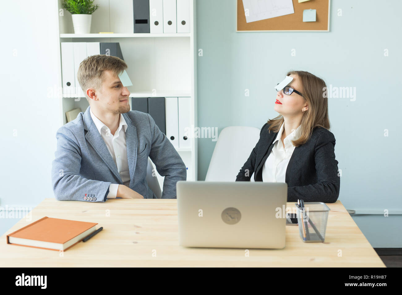 Business, break and people concept - Cheerful man and woman playing ...