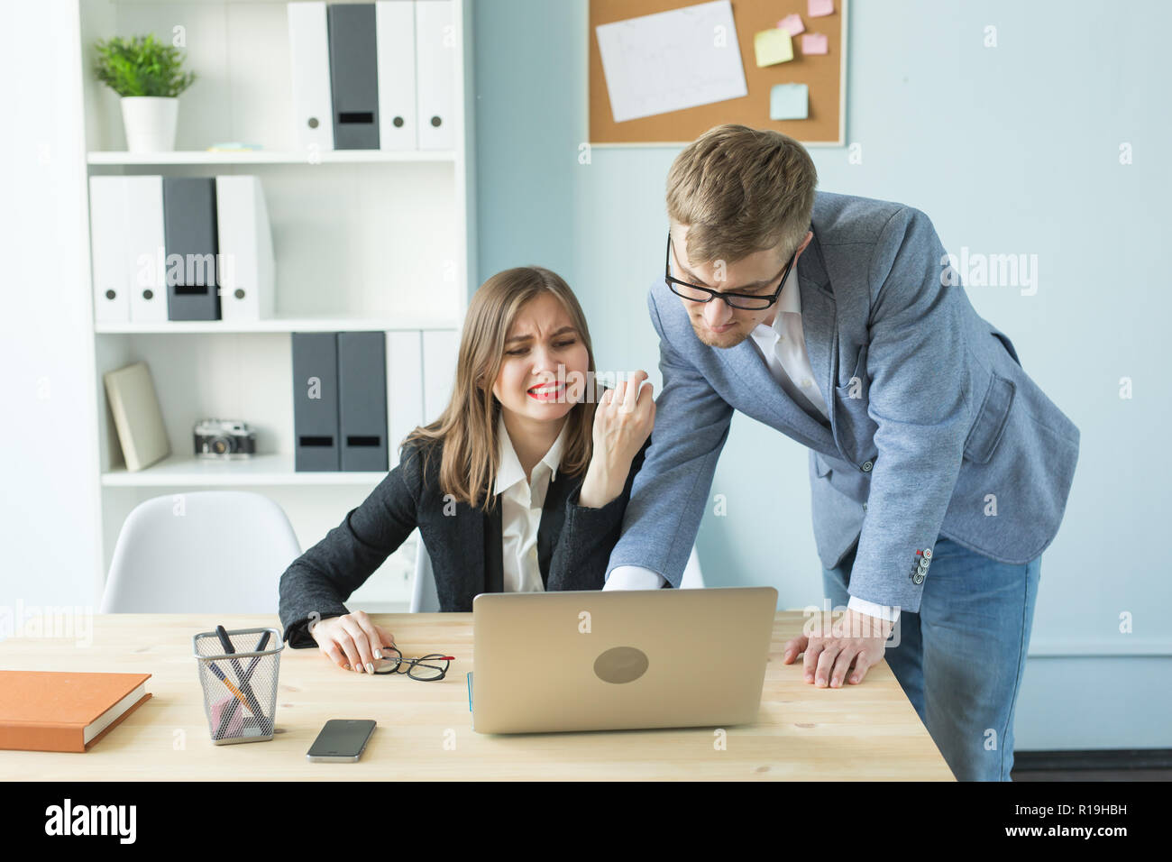 Business, stress and people concept - woman and man are working ...