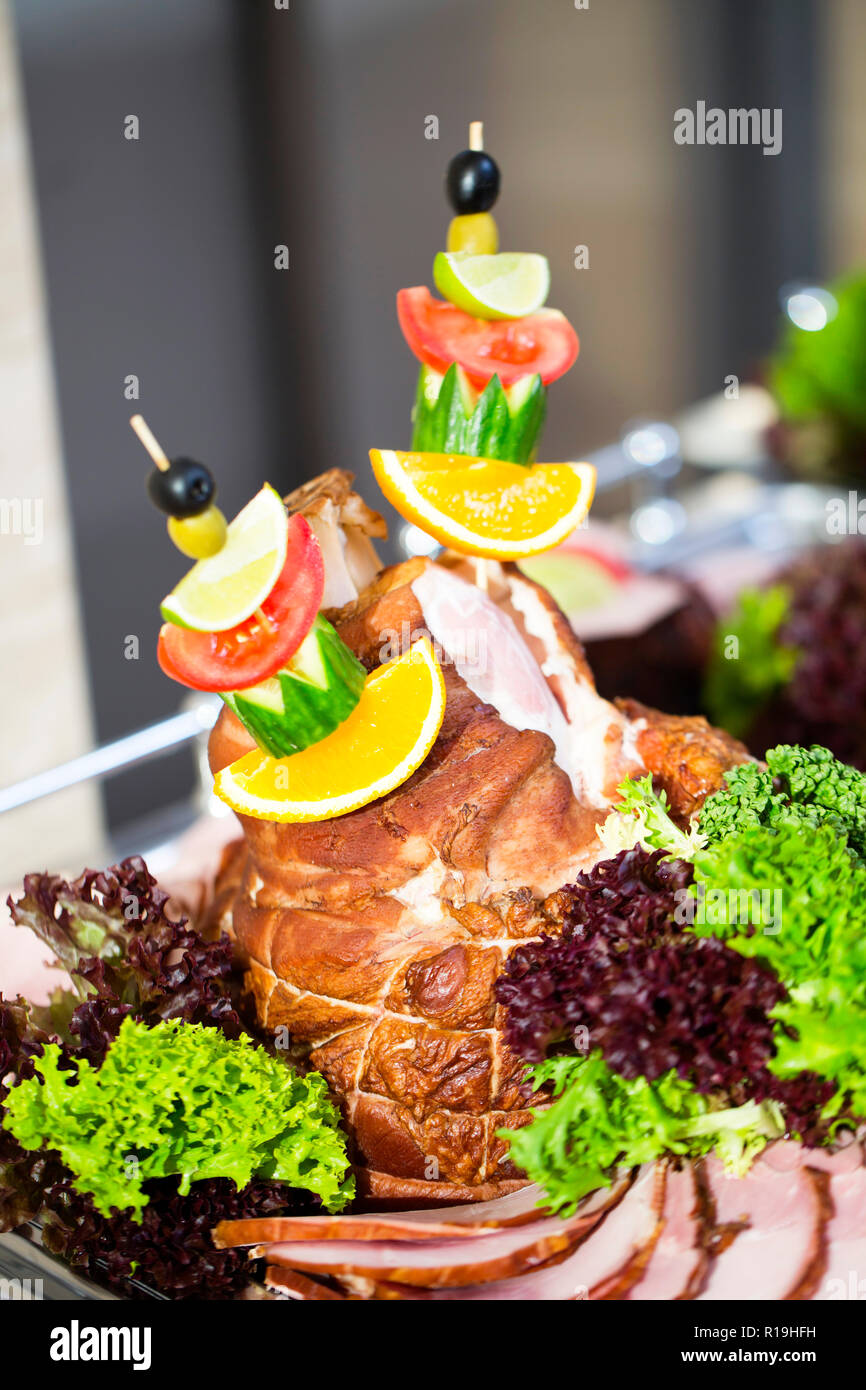 A beautifully decorated table for a family celebration with cold meats ...