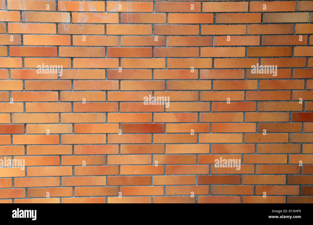 A wall of red bricks. Background - Red brick wall Stock Photo - Alamy
