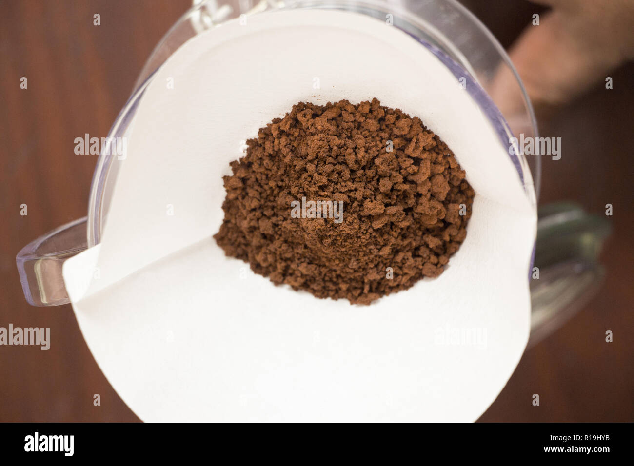 Drip coffee with paper filter tool on wood background Stock Photo - Alamy