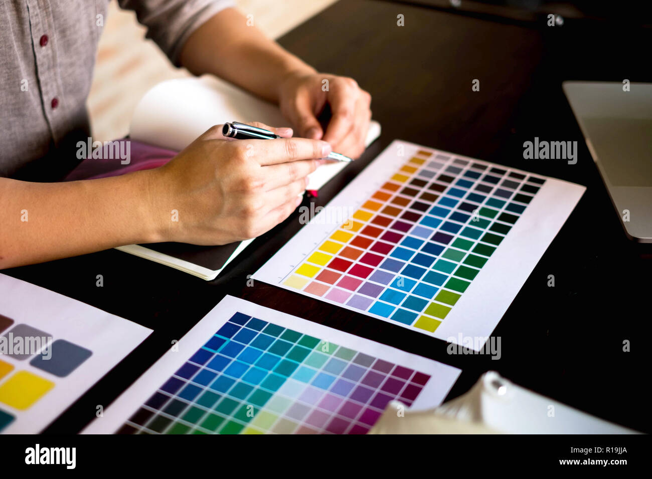 Graphic designers choose colors from the color bands samples for design ...
