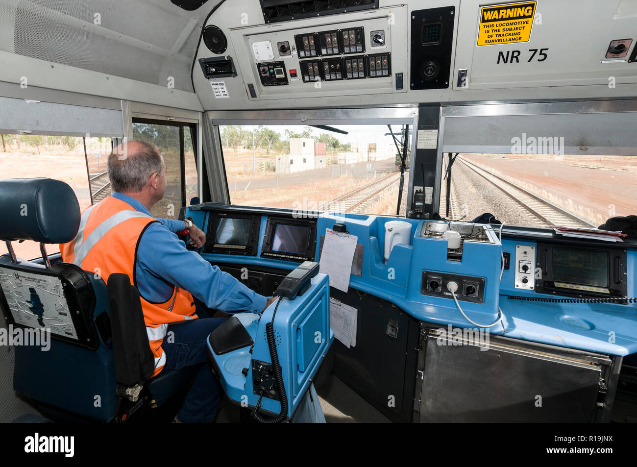 One of the two train drivers at the controls in his cab of the leading ...