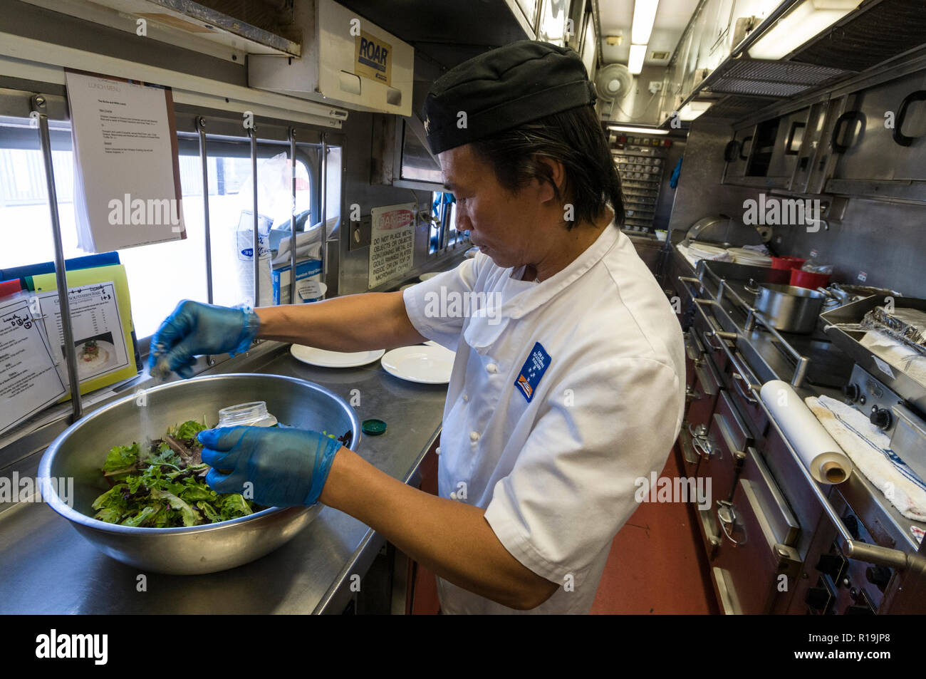 One of the two chefs on board The Ghan train kitchen, preparing dinner ...