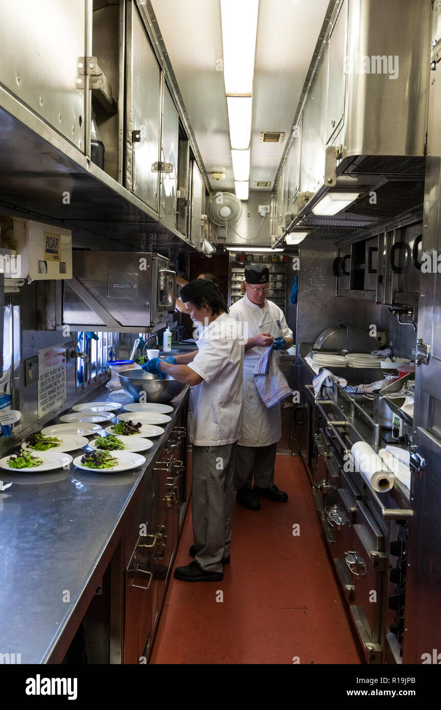 Two chefs preparing lunches in the kitchen onboard the Ghan train in ...