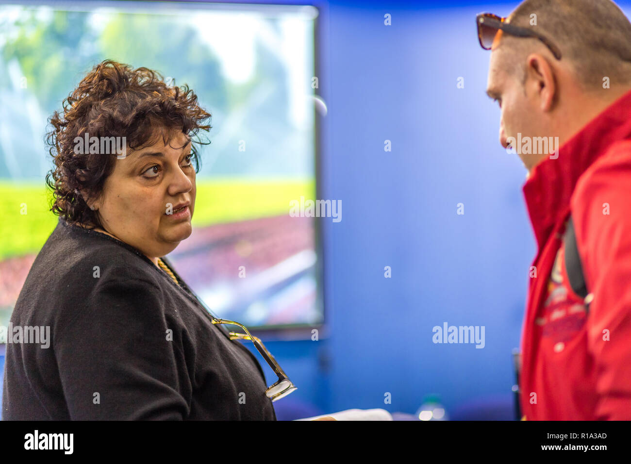 Bologna, Italy. 10th November, 2018. Booth presenter welcoming business ...