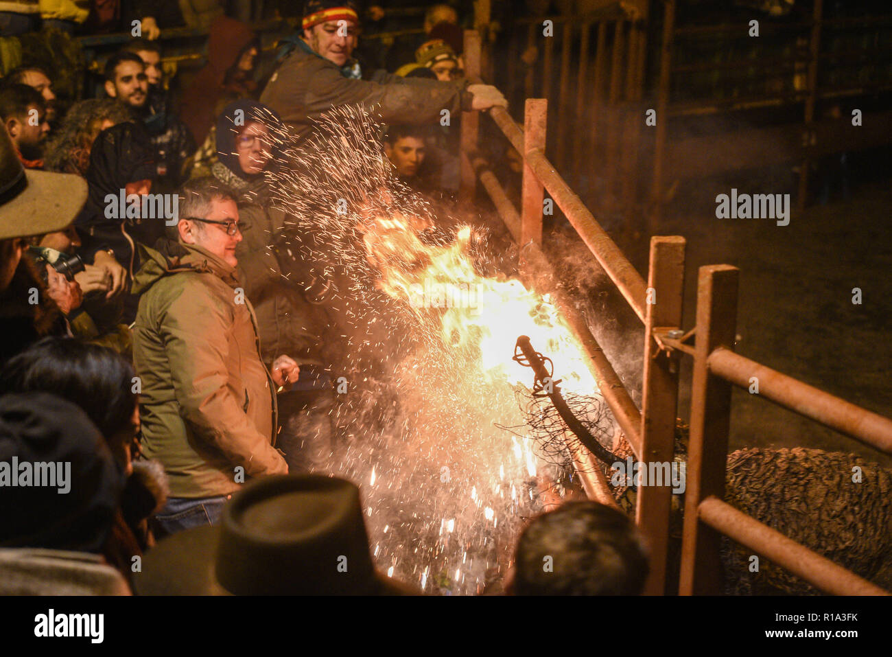 Revelers watch at a fire bull during the 'Toro de Jubilo' Fire Bull ...