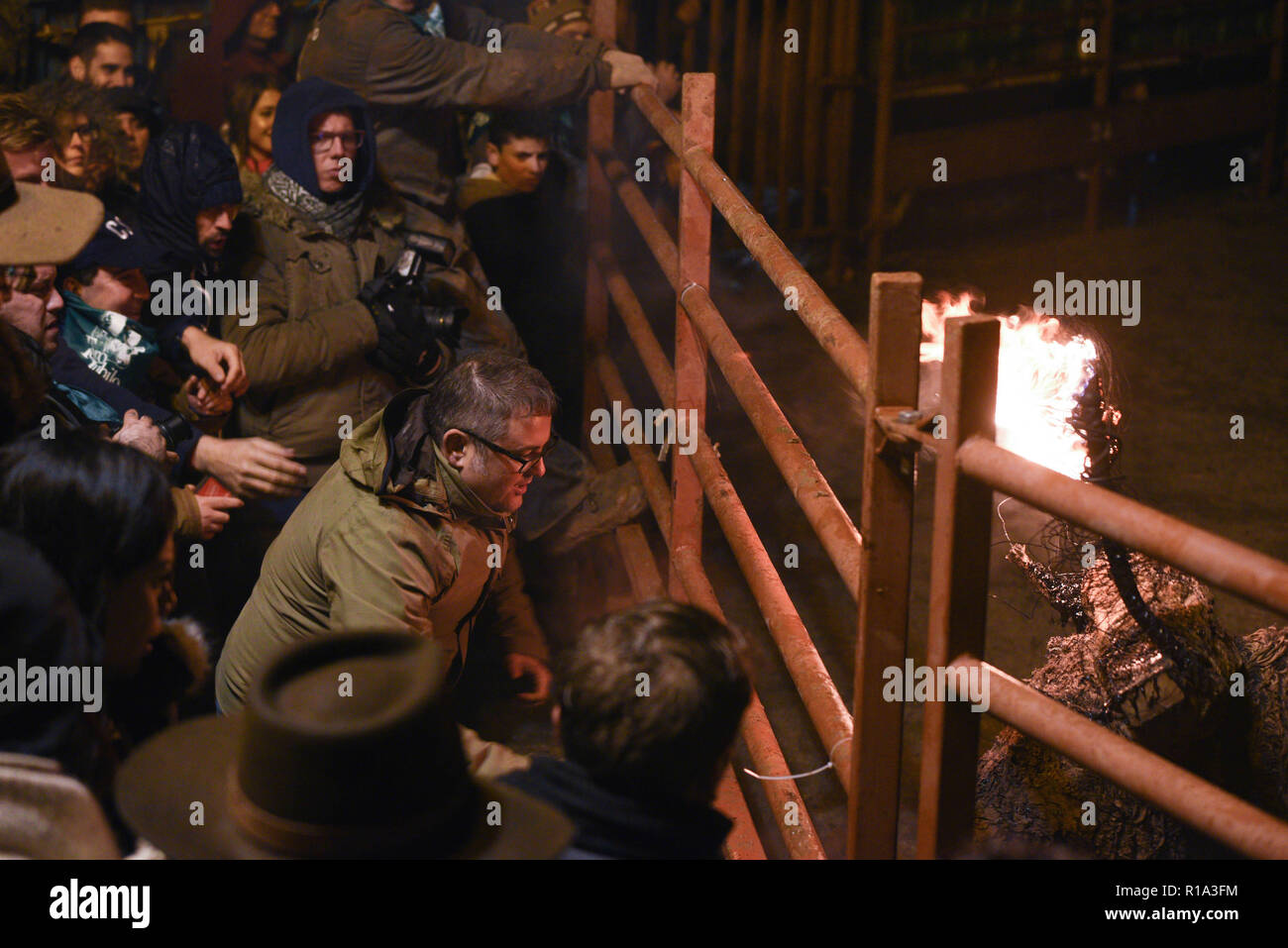 Revelers watch at a fire bull during the 'Toro de Jubilo' Fire Bull ...
