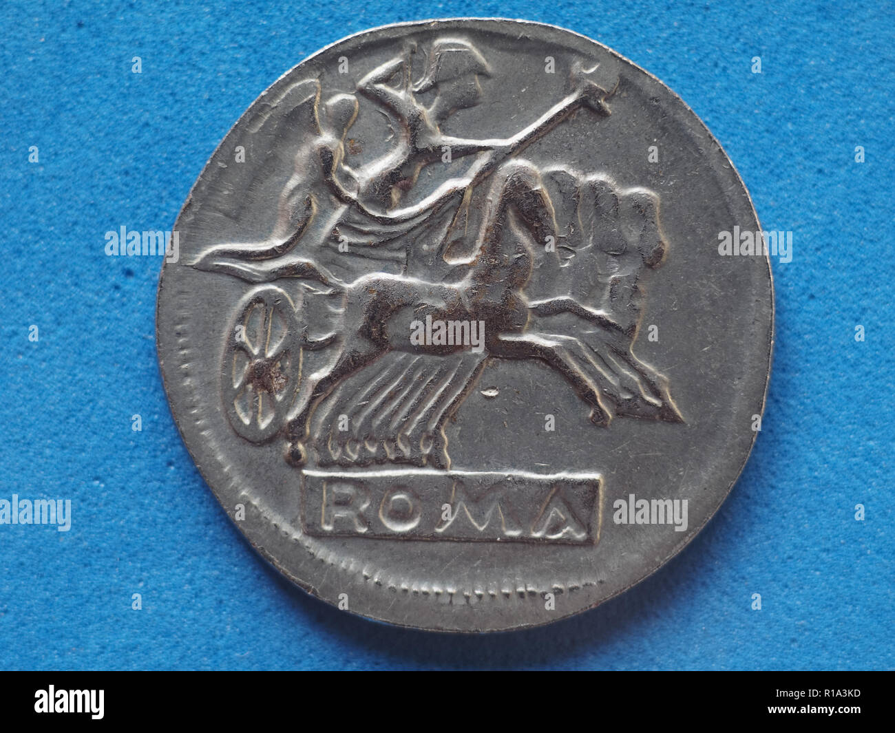 close macro detail of ancient roman coin with horses and biga (chariot ...