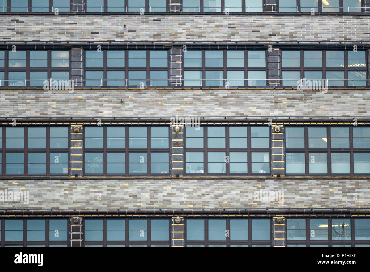 old facade with many windows Stock Photo - Alamy