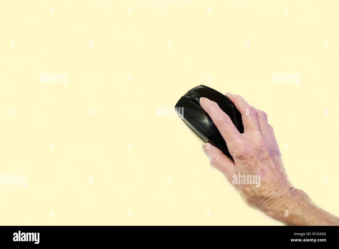 Elderly old senior hand holding wireless mouse learning computer ...