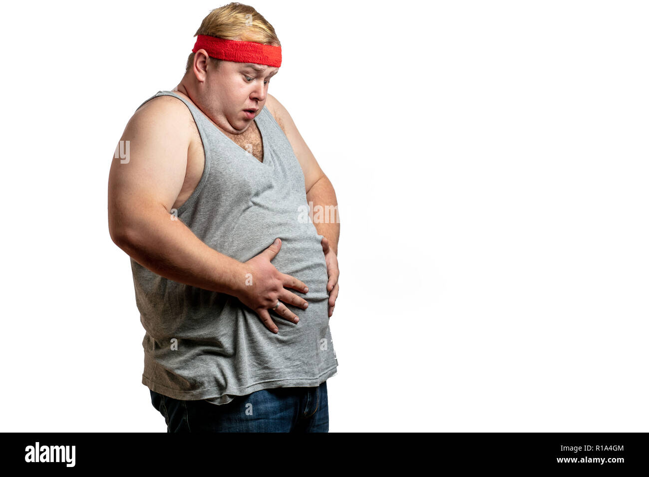 Fat young man making a gesture pointing to himself isolated on white ...