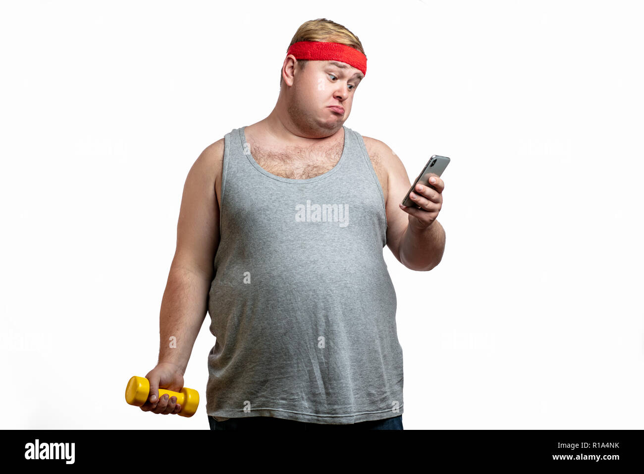 close up portrait of overweight obese man's hand holding his big belly ...