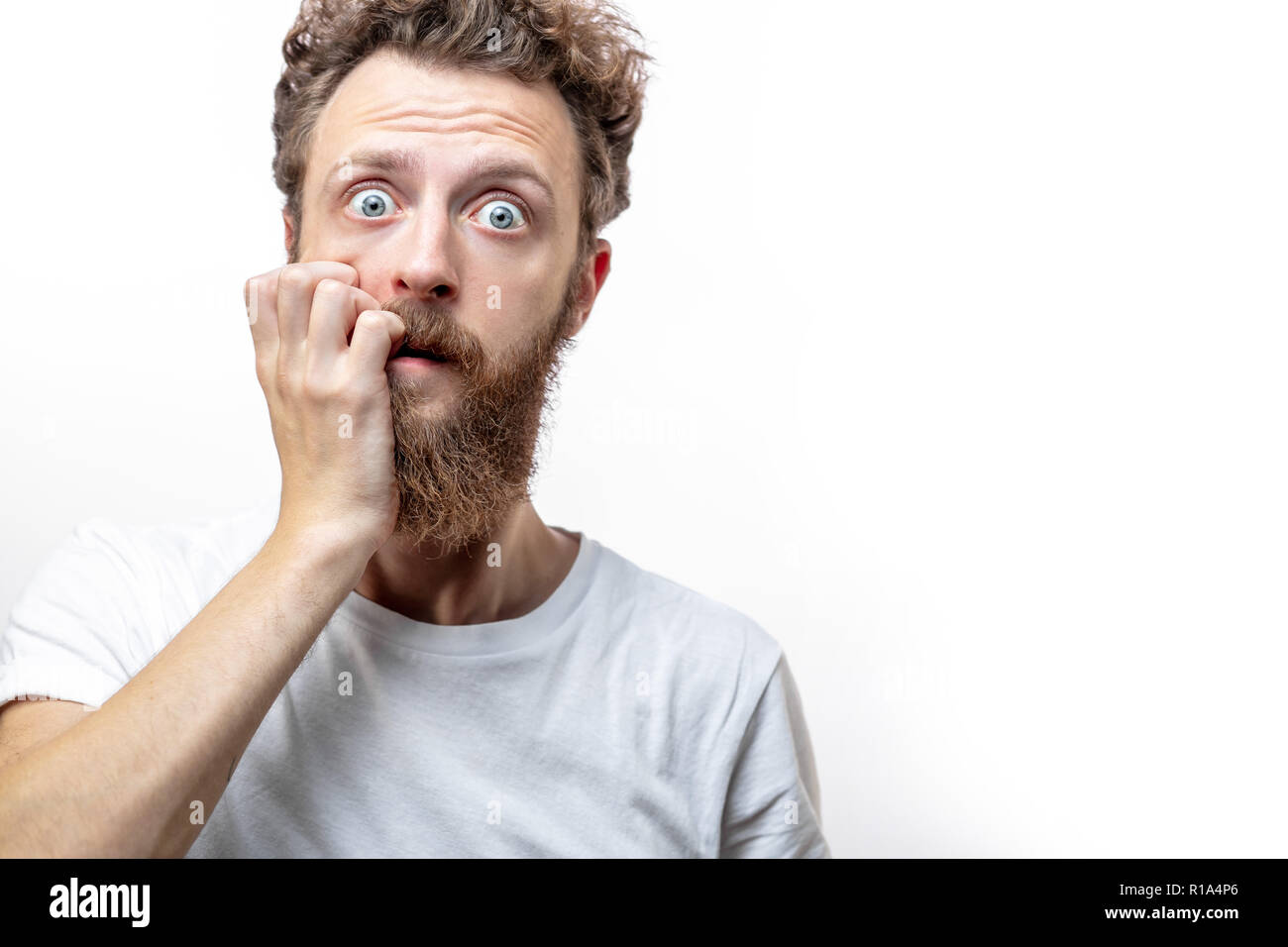 Bearded man in despair with hand near mouth isolated over white ...