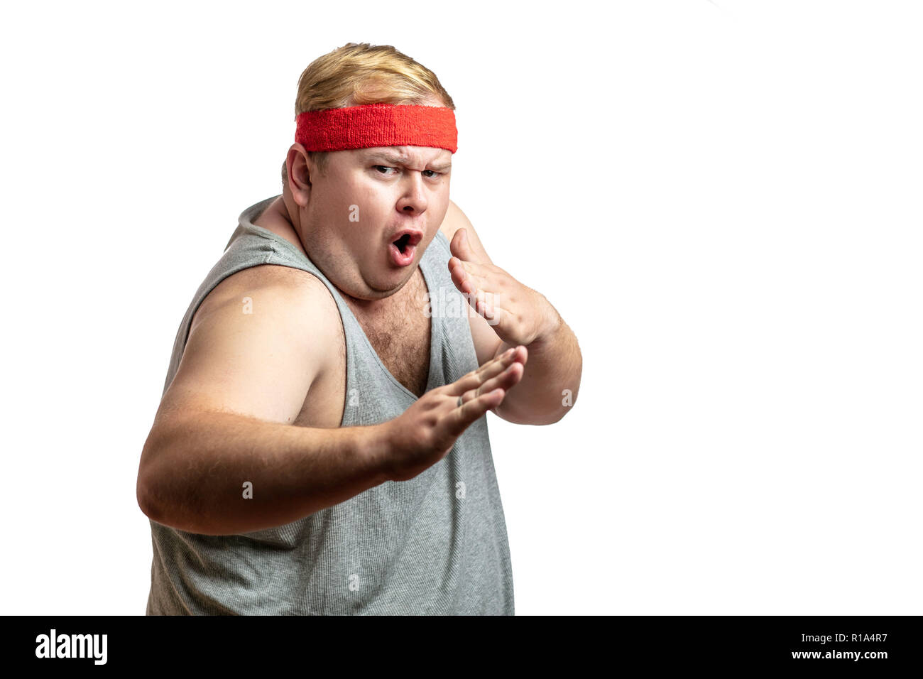 Fat man, feeling furious, in fight stance ready to hit, white isolated ...