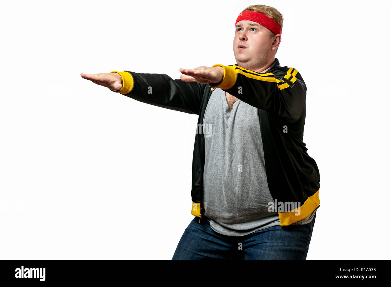 Overweight man resting, tired after training, with hand on forehead ...