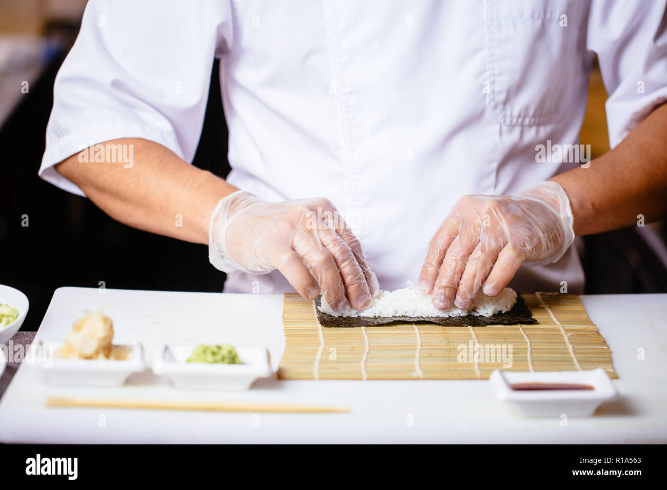 close up cropped photo. male chef is putting the rice to cook set Stock ...