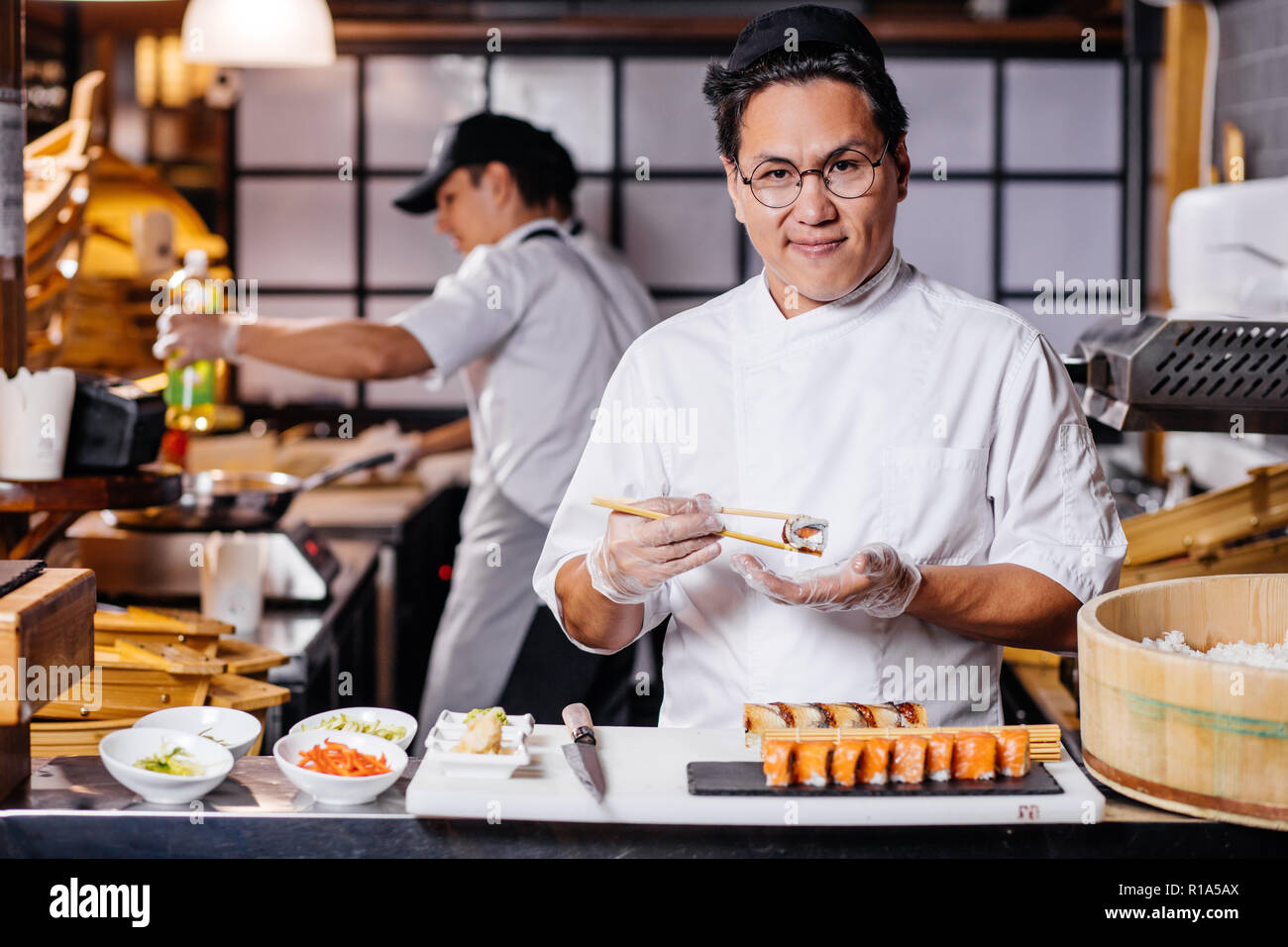 talented man offering his well-prepared roll Stock Photo - Alamy