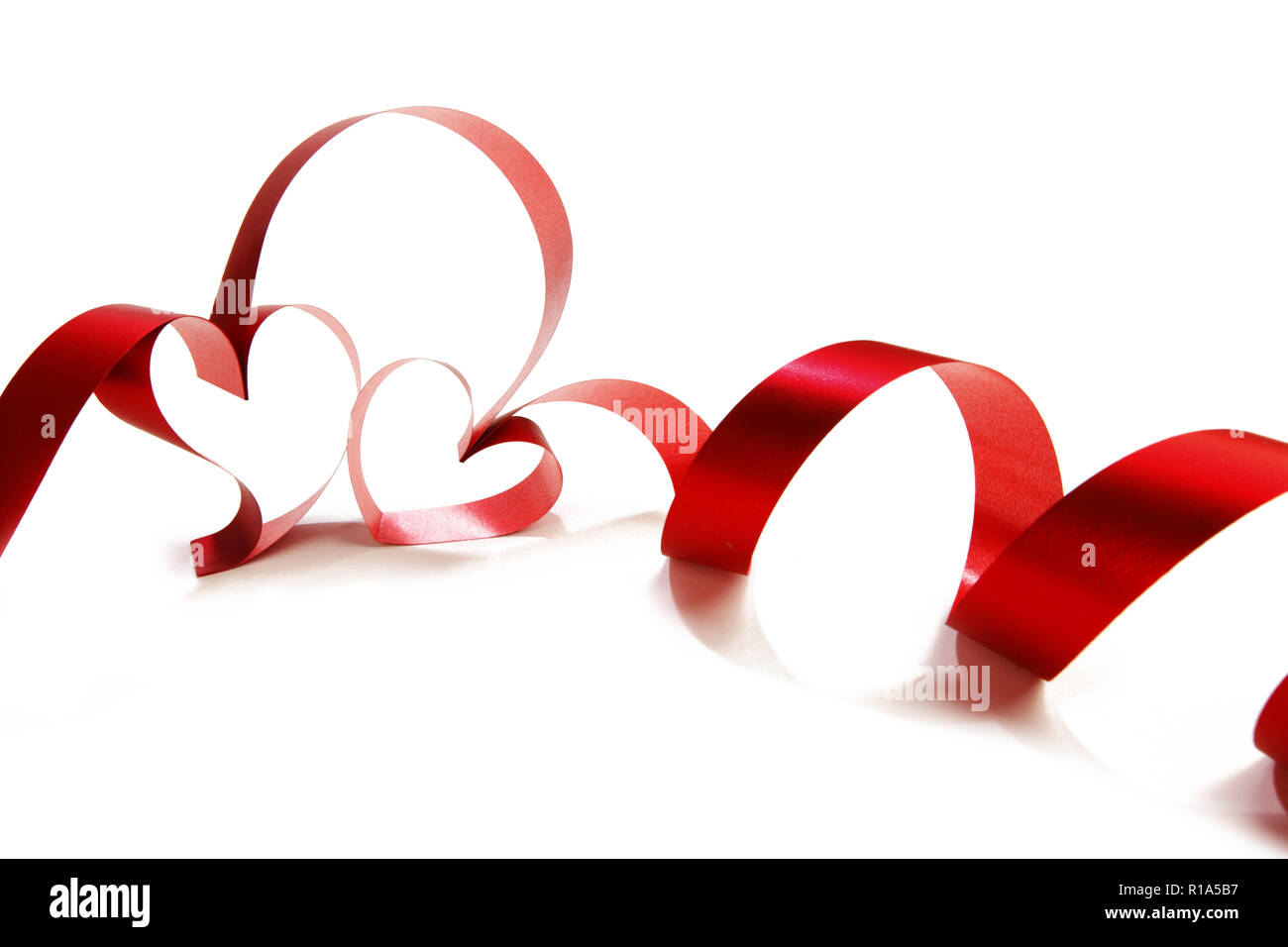 Heart shaped red ribbon isolated on white background Stock Photo - Alamy