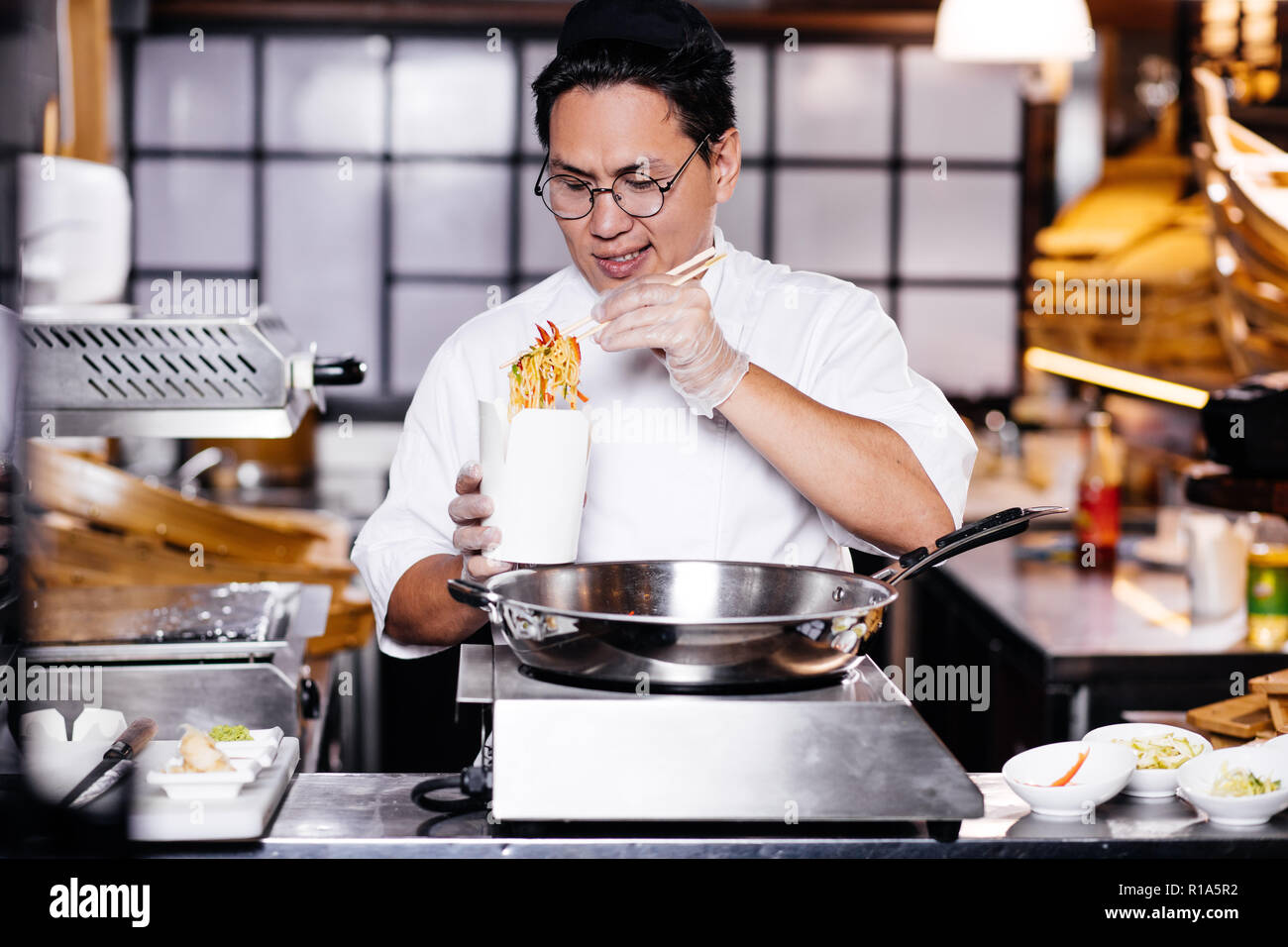 talented chef has cooked chinese noodle Stock Photo - Alamy
