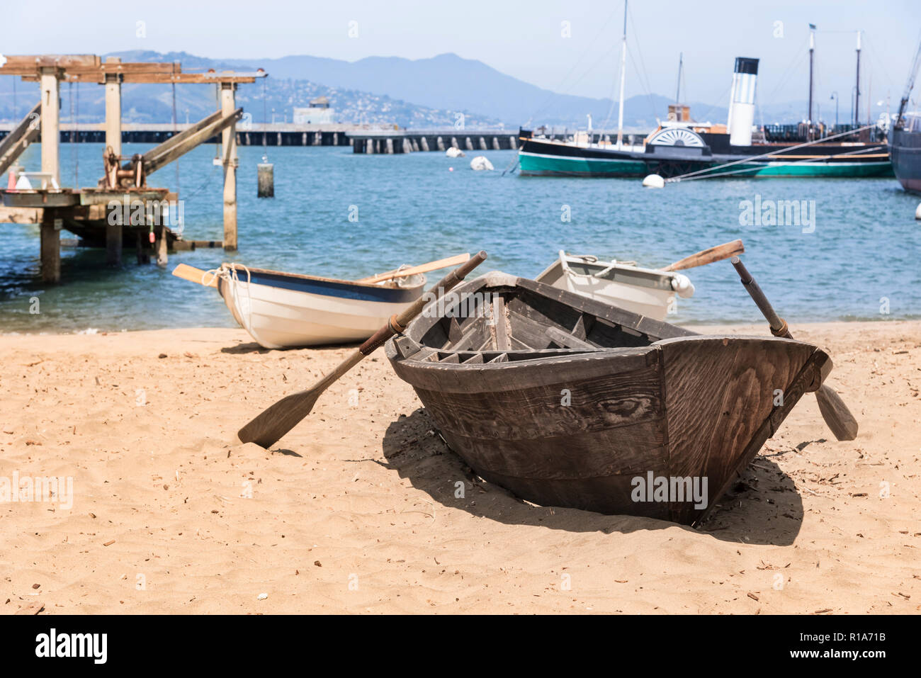 landscape of a wooden boat harbored on the beach Stock Photo - Alamy