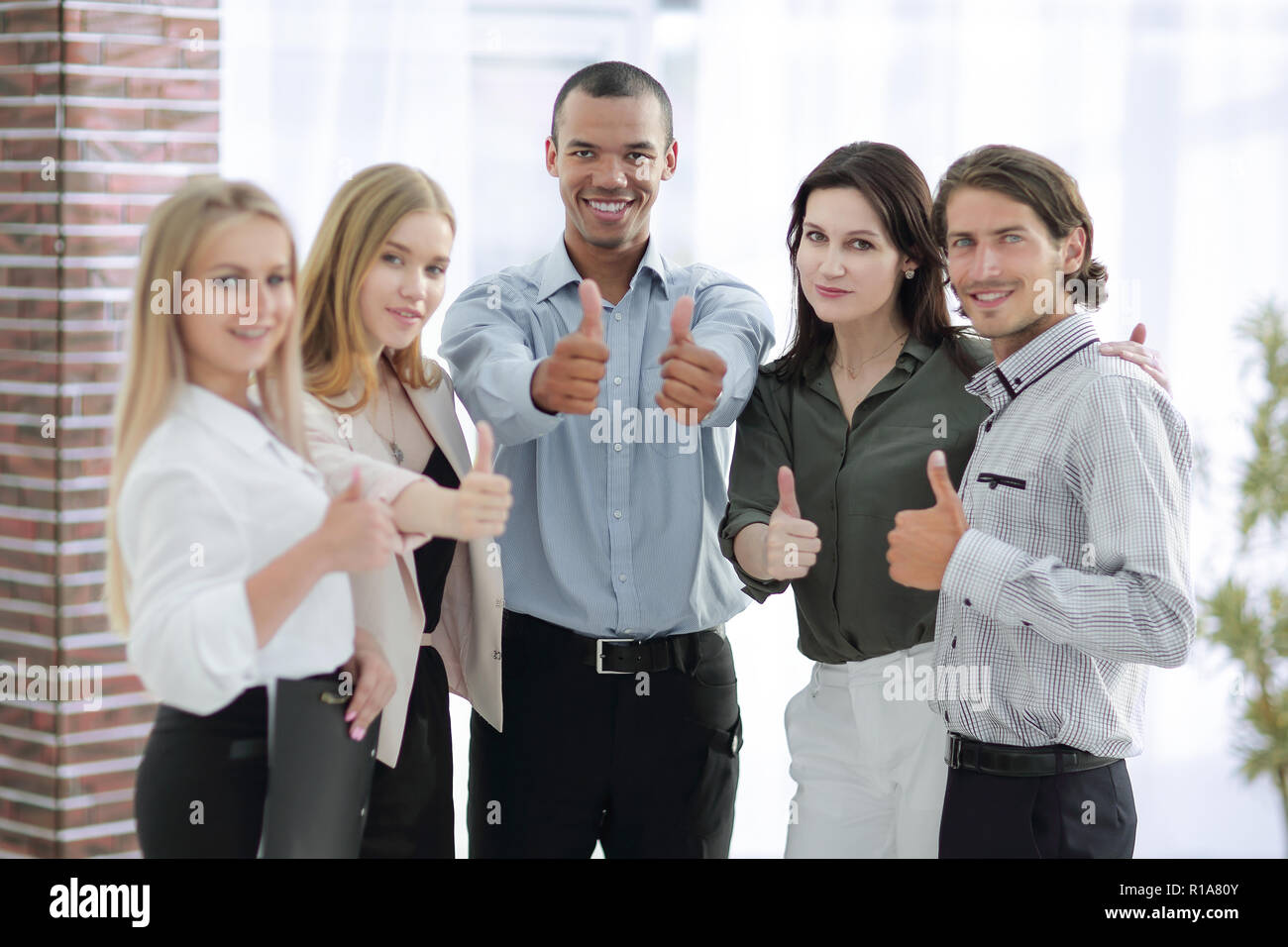 Business team showing thumb hi-res stock photography and images - Alamy