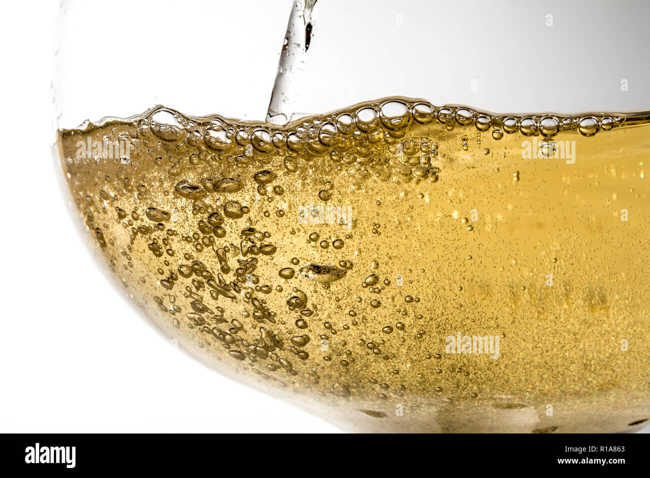 Stream of wine being pouring into a glass closeup, wine, splashing ...