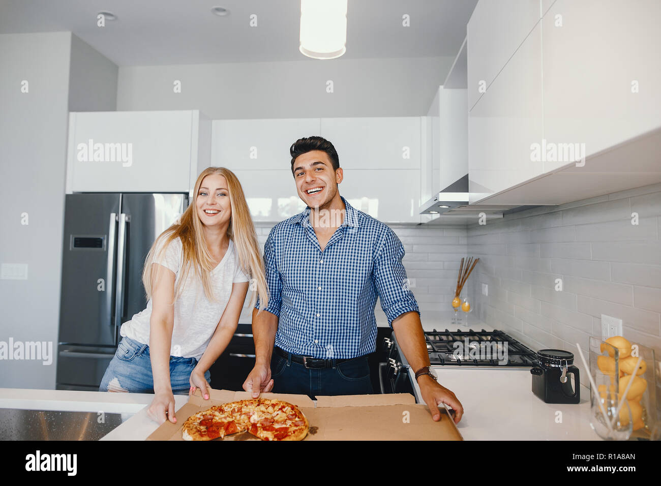 Husband and wife eating pizza hi-res stock photography and images - Alamy