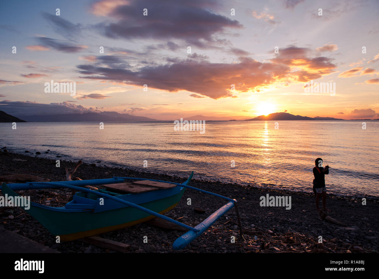 Scenic sunset at the shore of Batangas, Philippines Stock Photo - Alamy