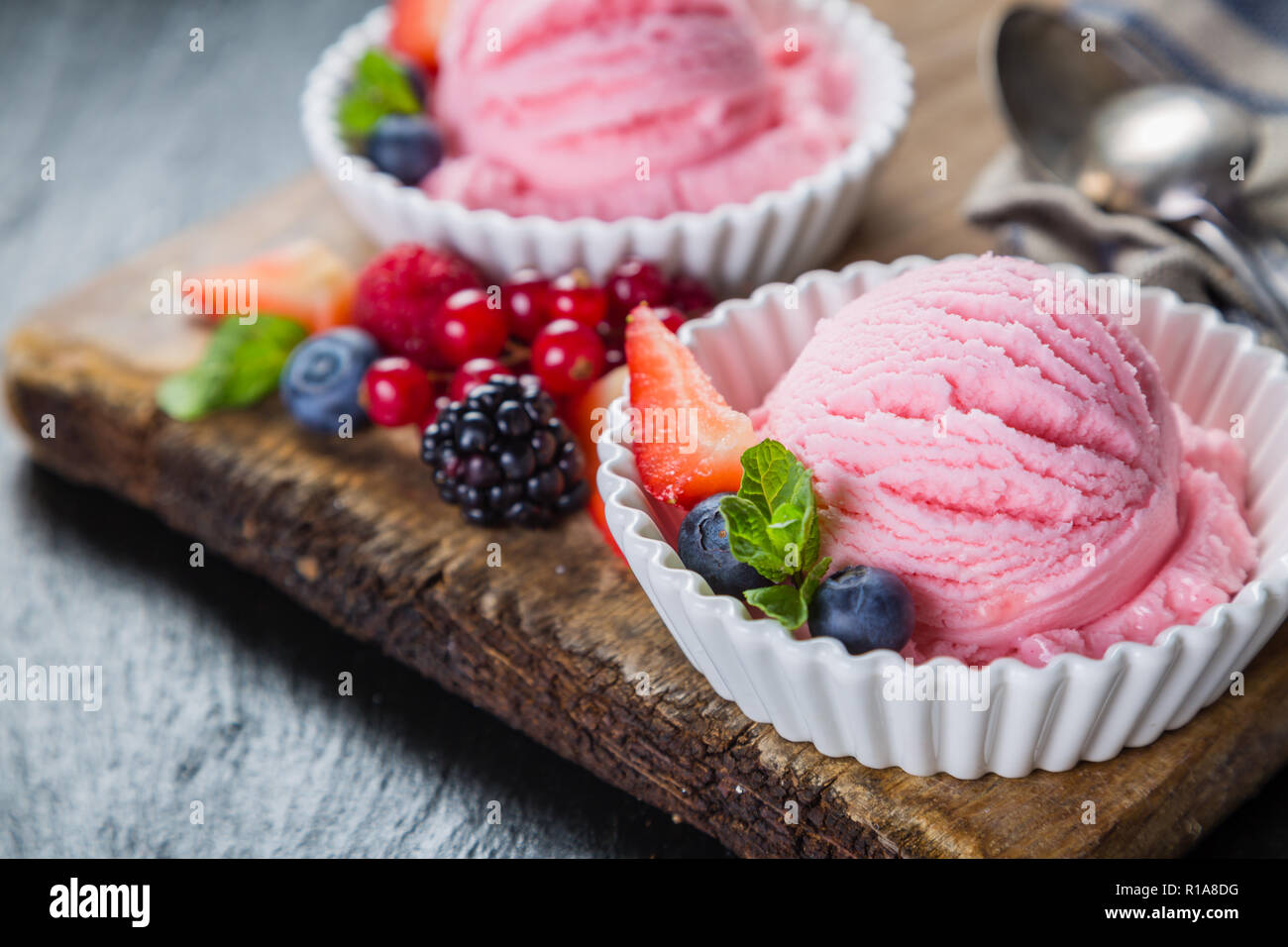 Berry ice cream with fresh fruits Stock Photo - Alamy