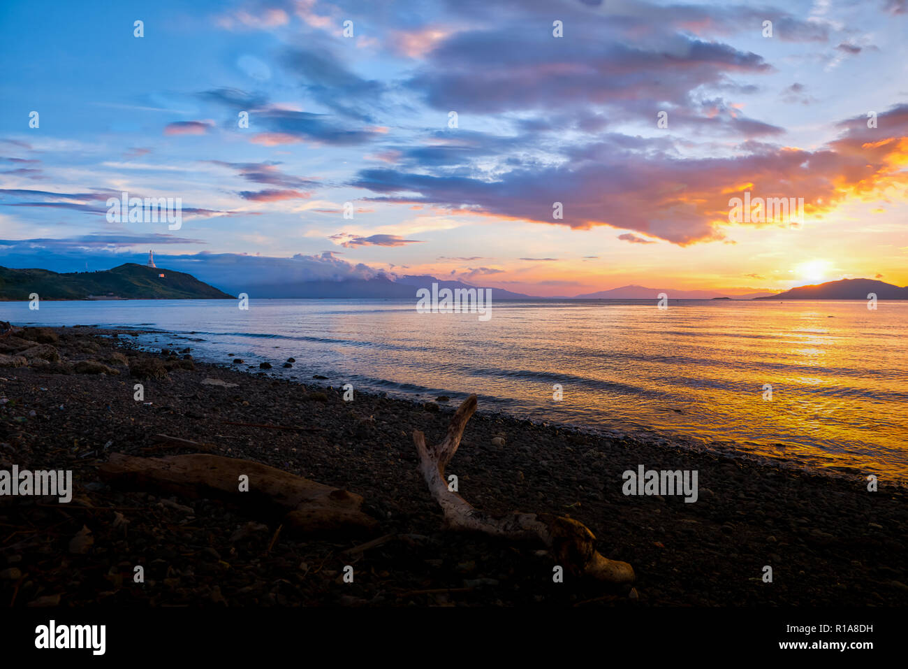 Scenic sunset at the shore of Batangas, Philippines Stock Photo - Alamy