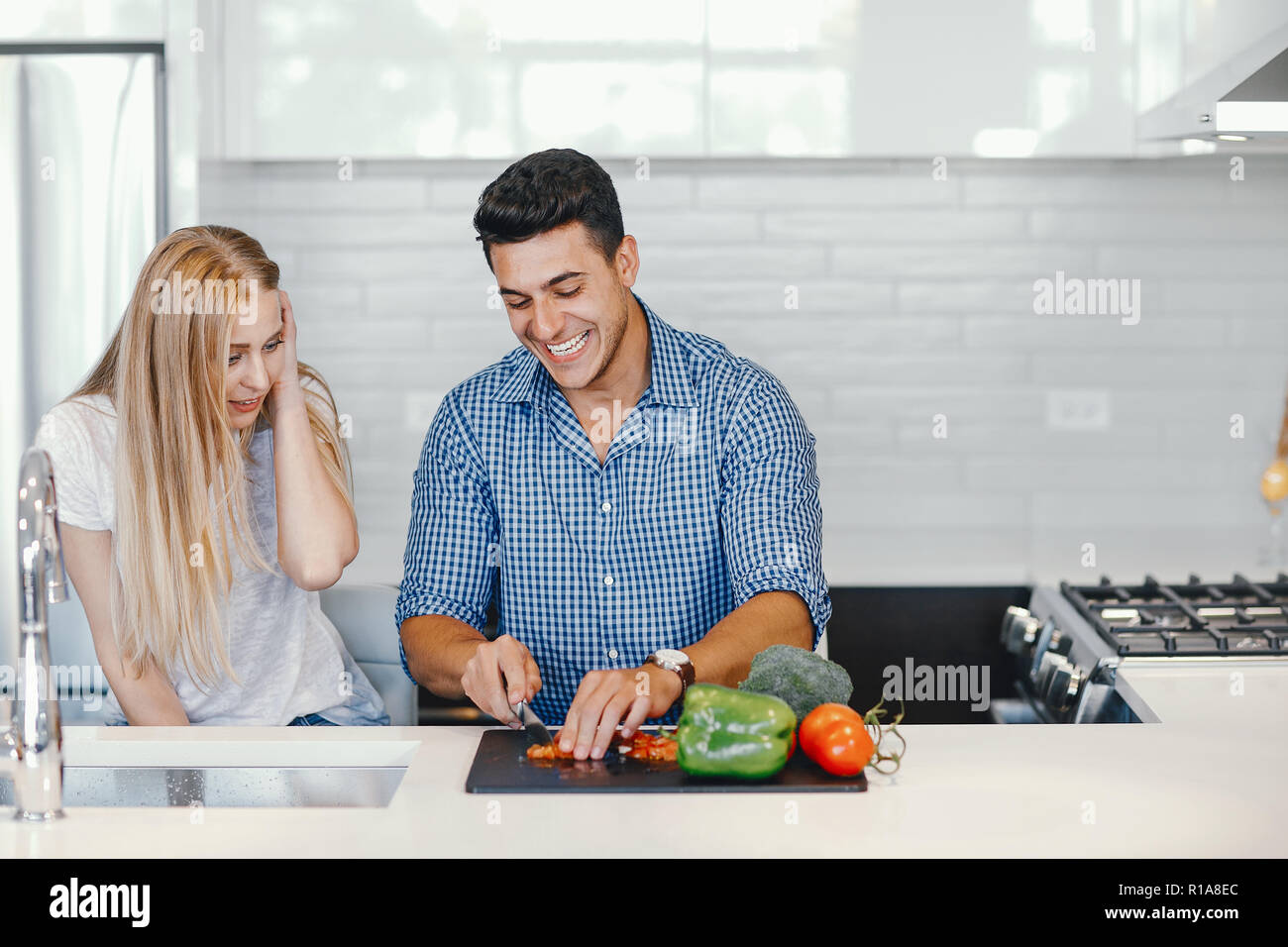 couple at home in a kitchen Stock Photo - Alamy