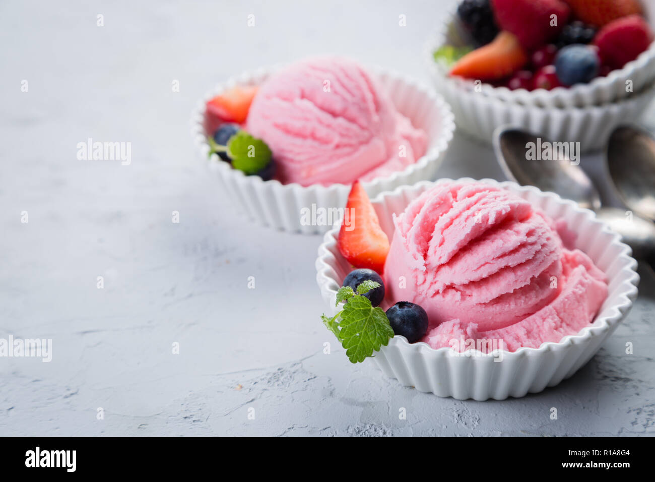 Berry ice cream with fresh fruits Stock Photo - Alamy