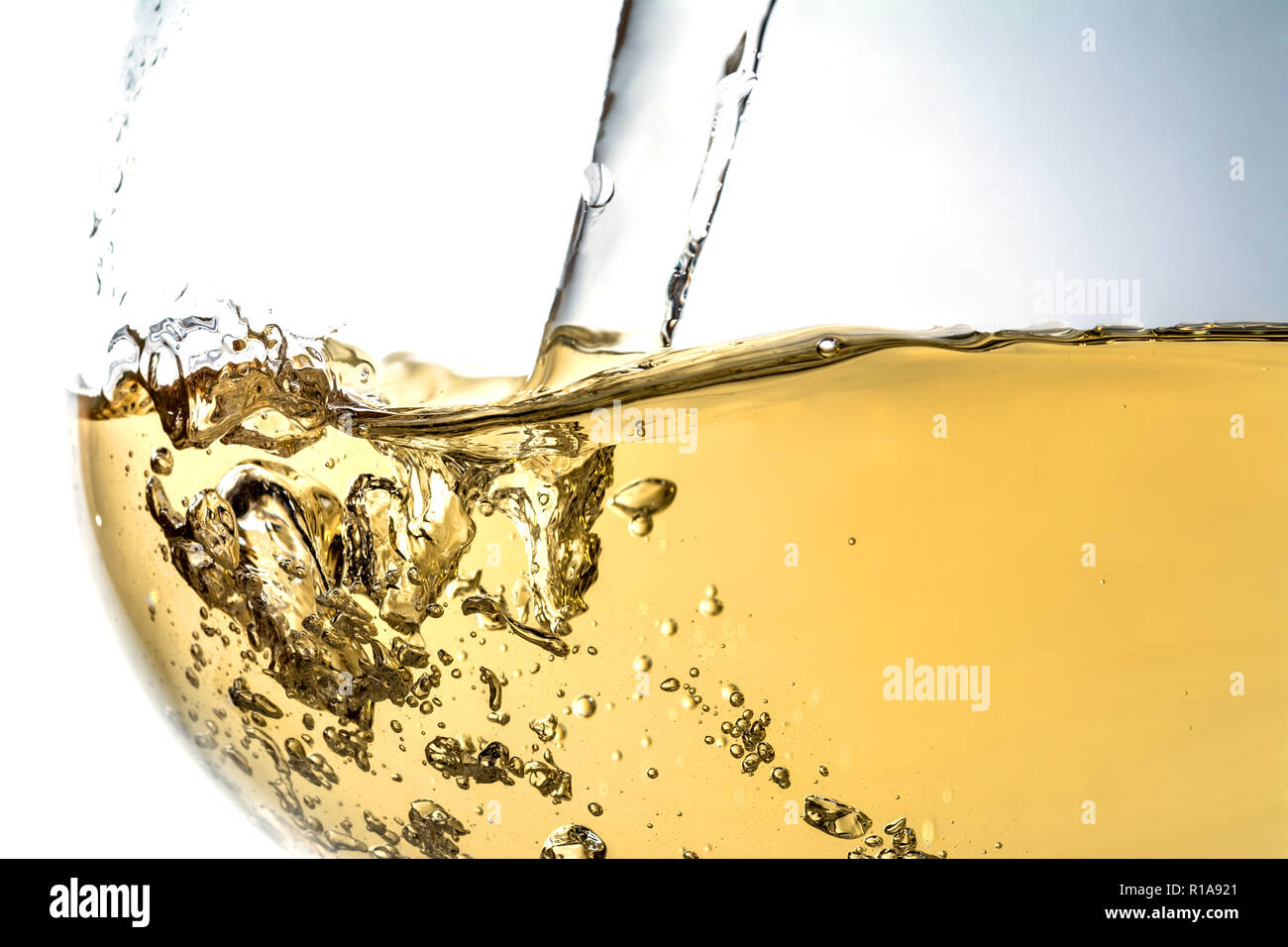 Stream of wine being pouring into a glass closeup, wine, splashing ...