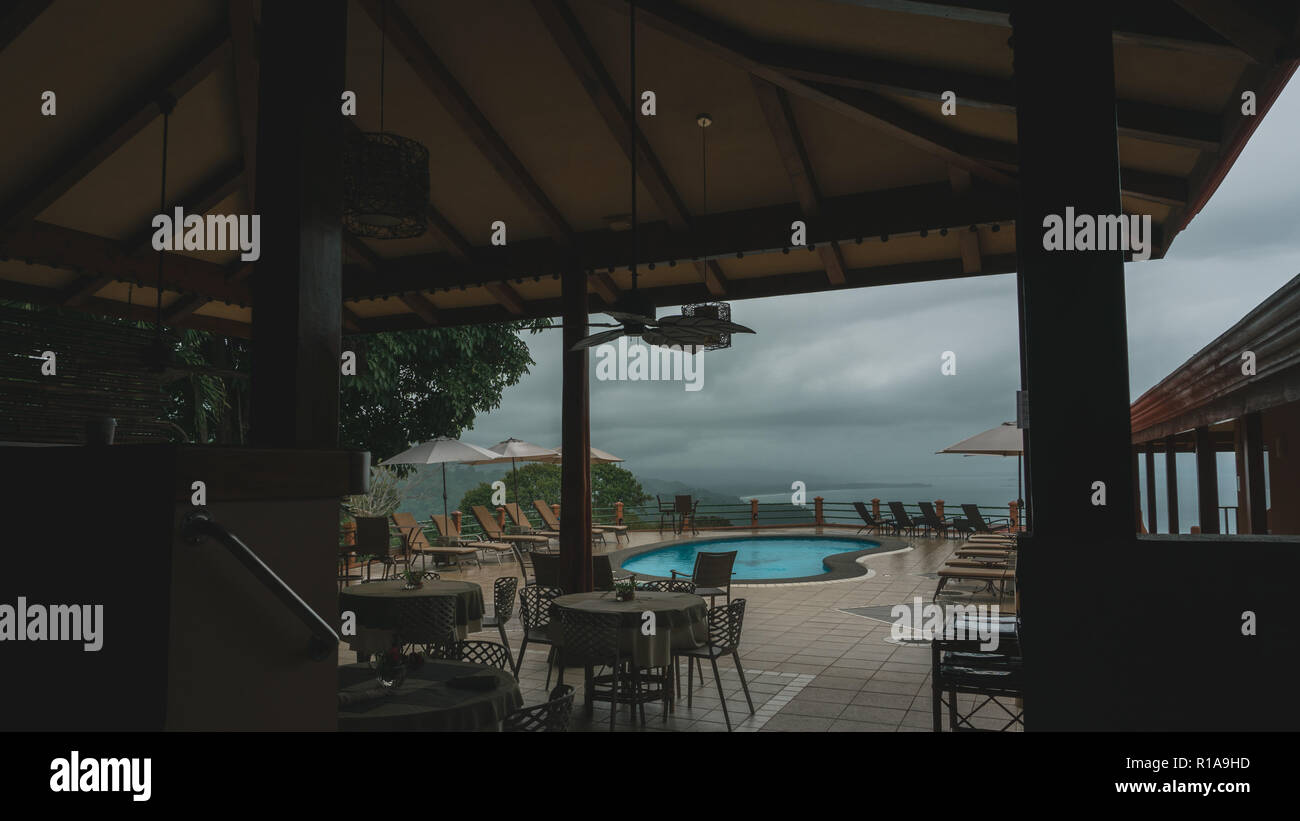 Restaurant pool view over big panorama with cloudy sky Stock Photo - Alamy