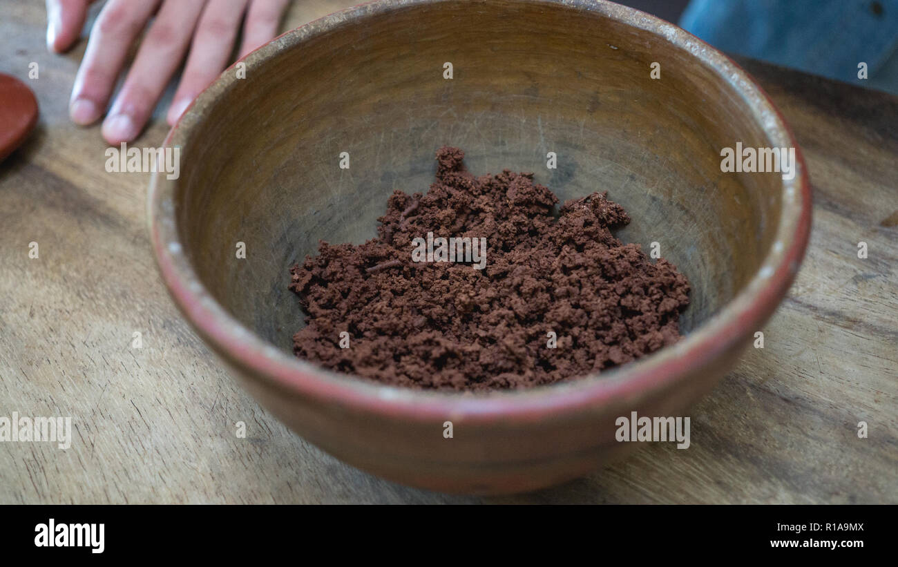 Cocoa powder in a bowl - process of making chocolate Stock Photo - Alamy
