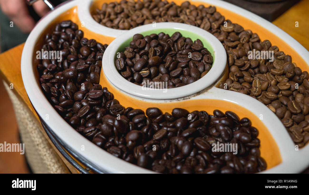 Different roasts of coffee beans - from light to espresso - in a ...