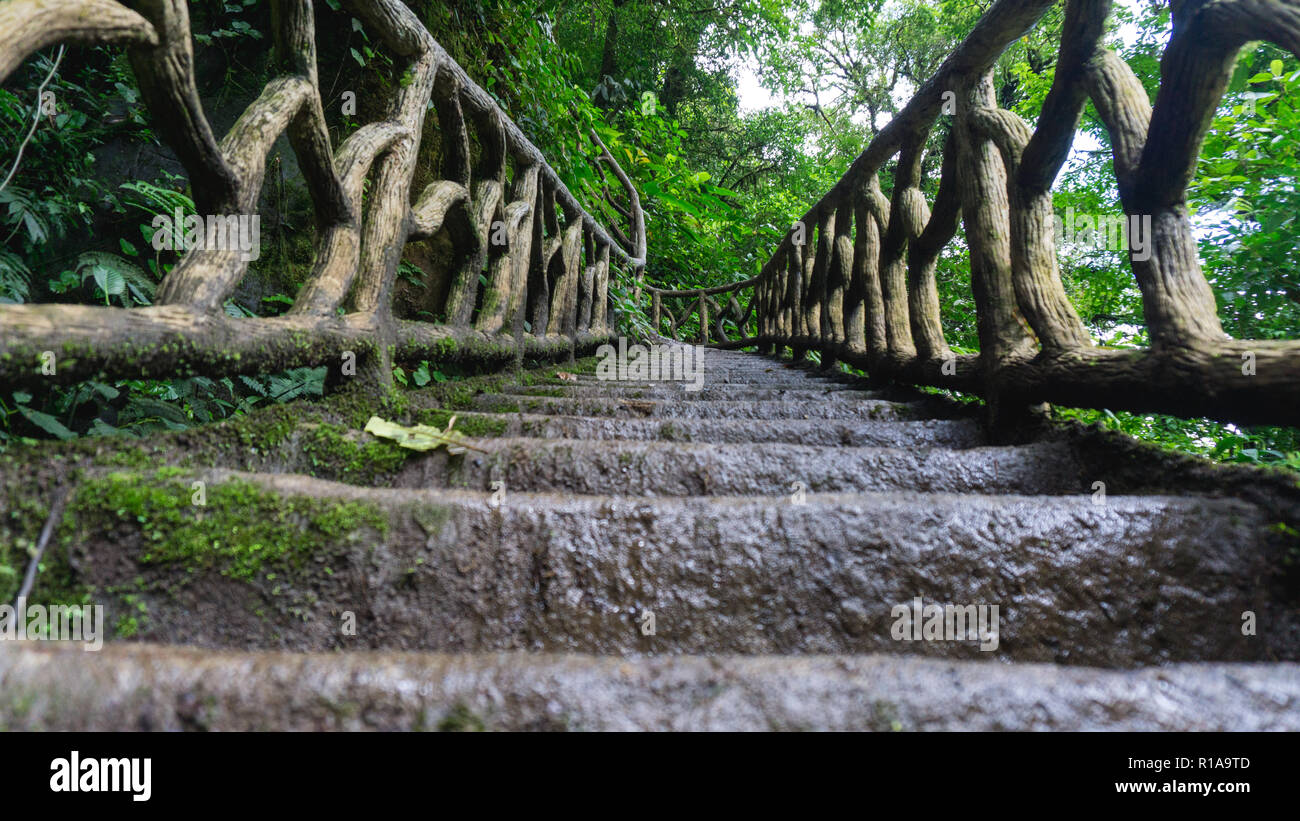 Beautiful steep rock stairs with wooden railings Stock Photo - Alamy