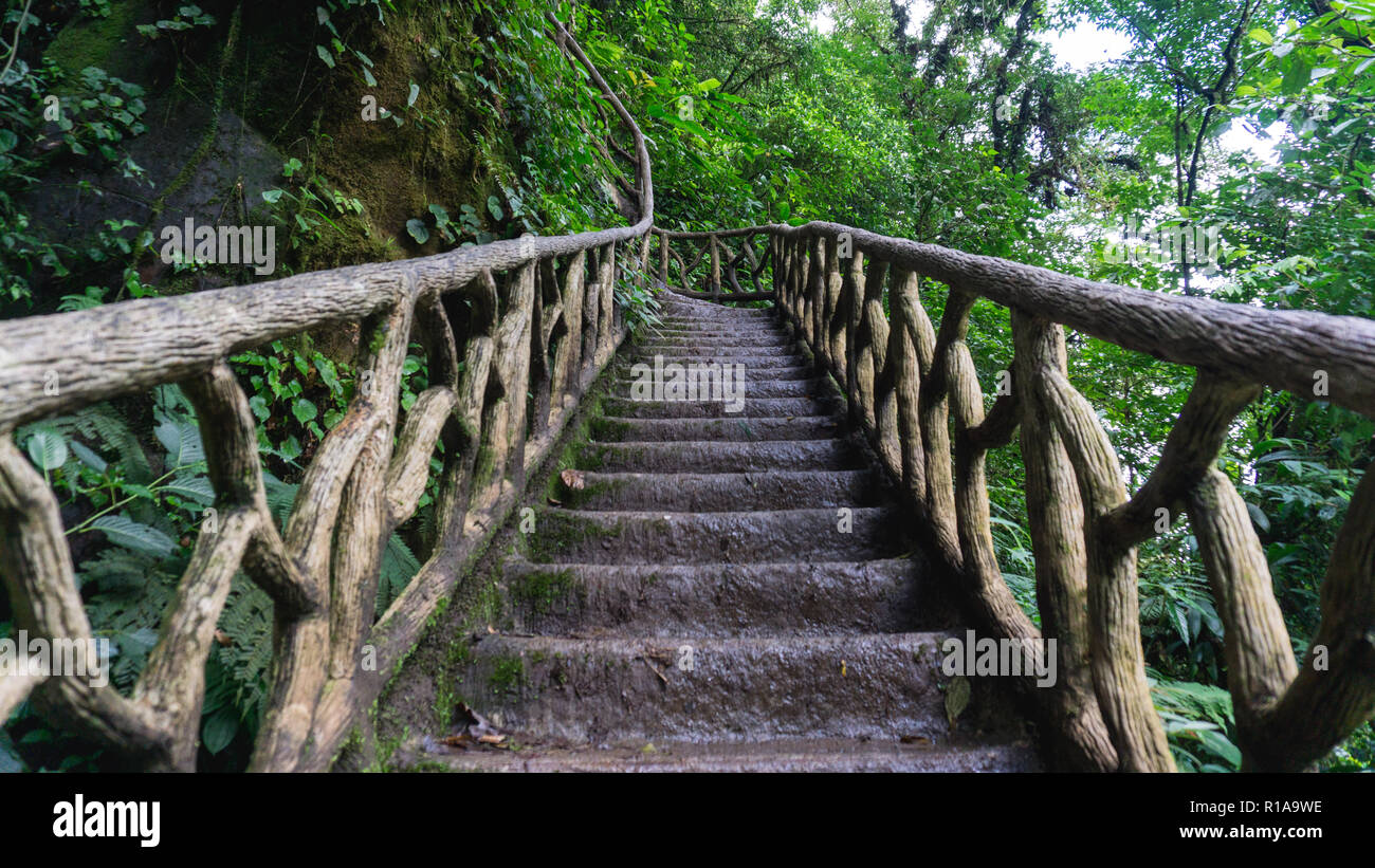 Beautiful steep rock stairs with wooden railings Stock Photo - Alamy
