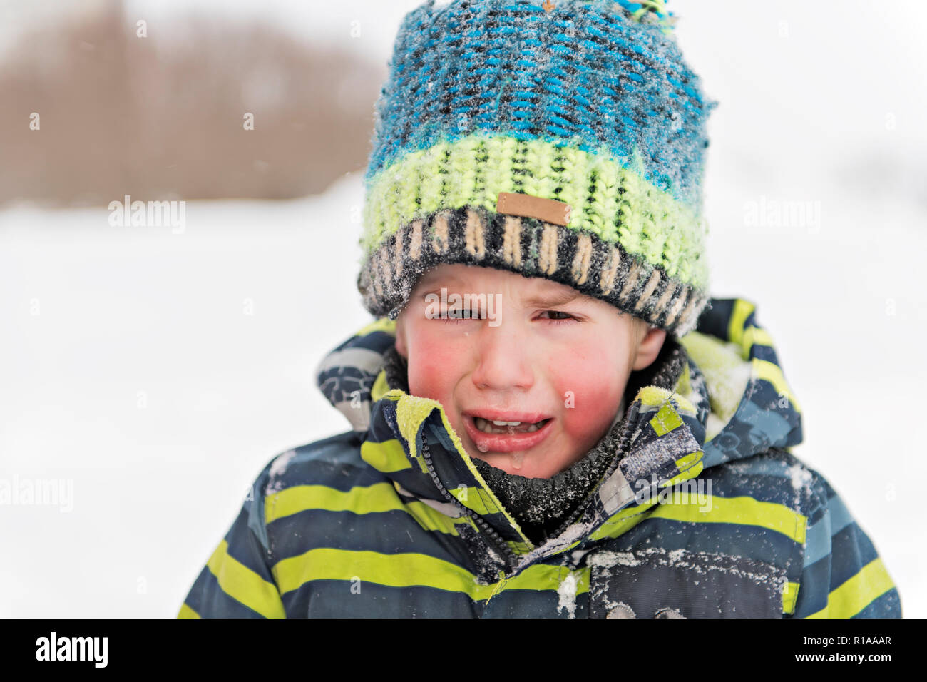 Sad boy snow hi-res stock photography and images - Alamy