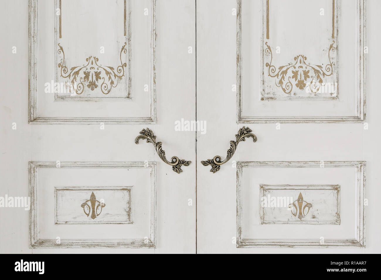 Large white door closed and vintage metal handles Stock Photo - Alamy