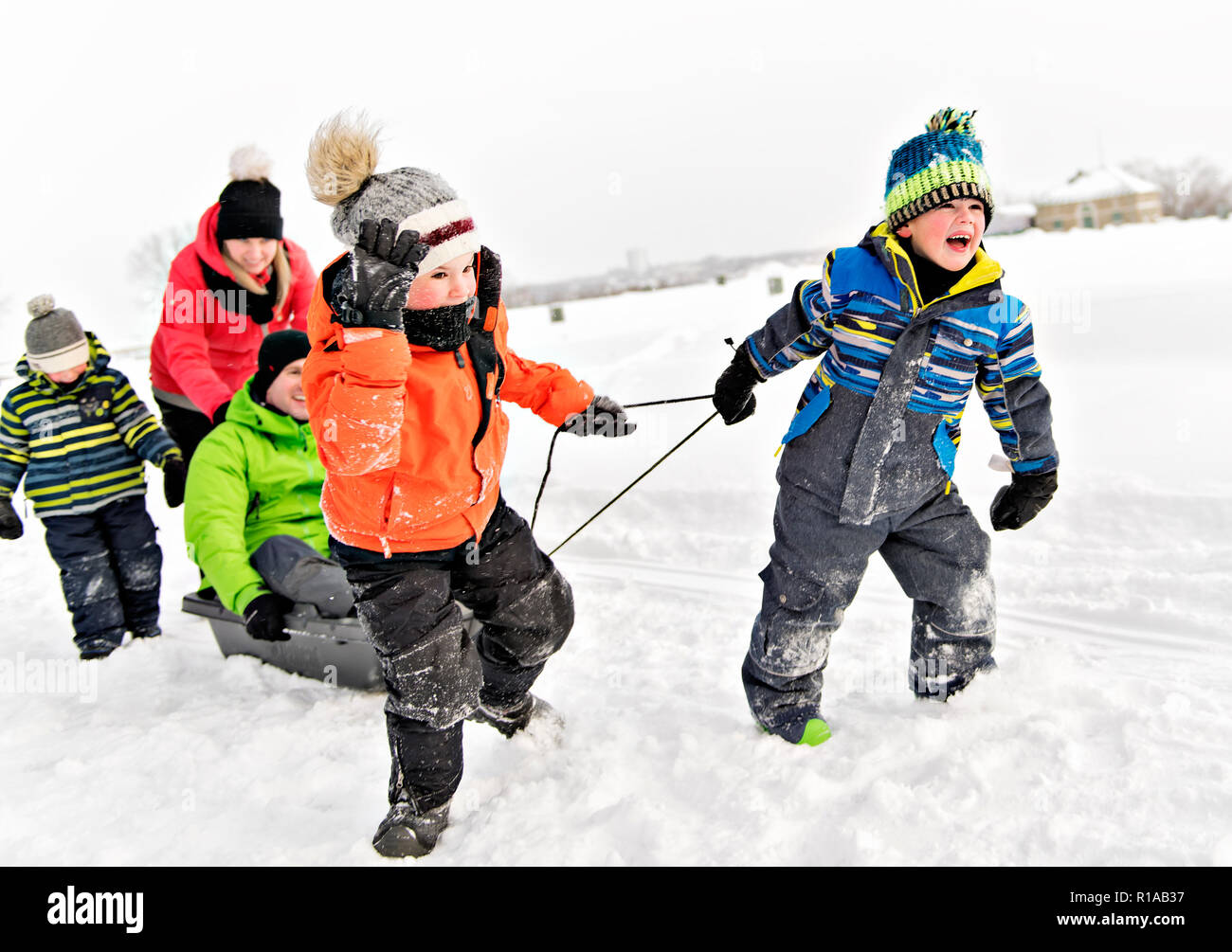 Boy pulling sledge hi-res stock photography and images - Alamy